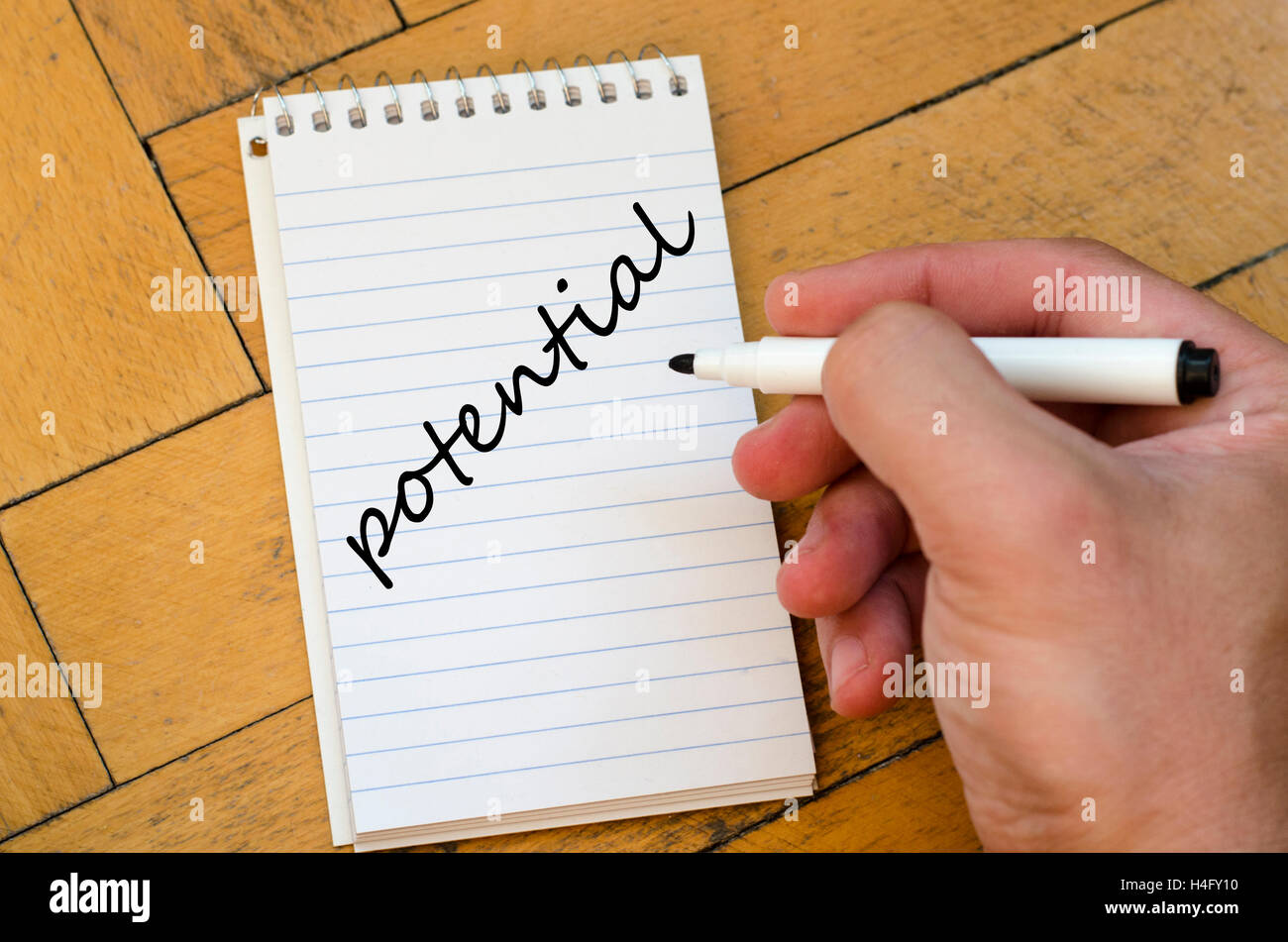 Potential text concept write on notebook Stock Photo - Alamy