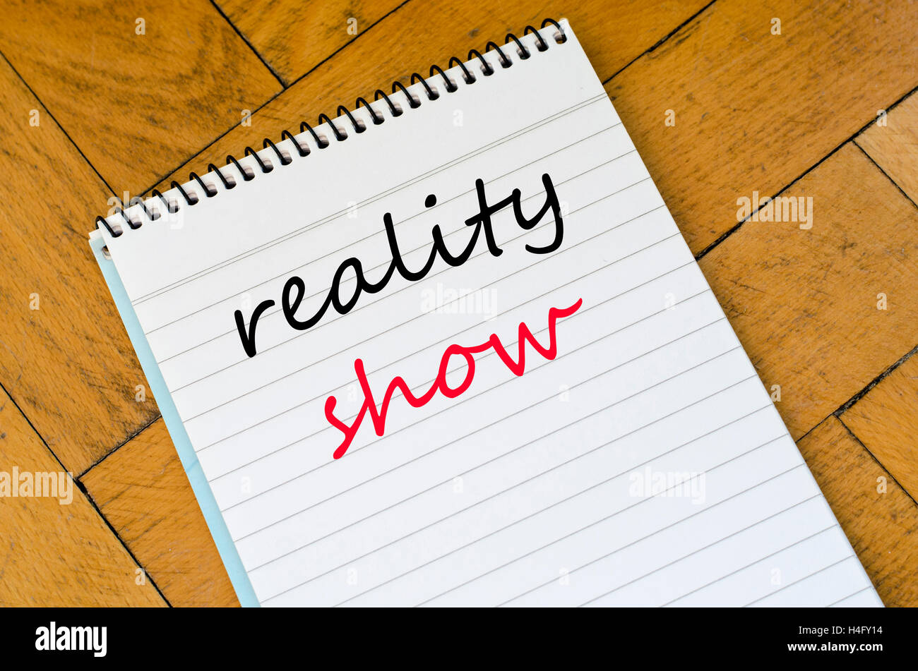 Reality show text concept write on notebook Stock Photo - Alamy