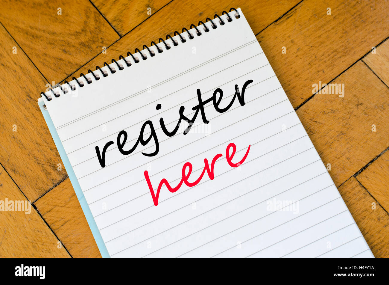 Register here text concept write on notebook Stock Photo - Alamy