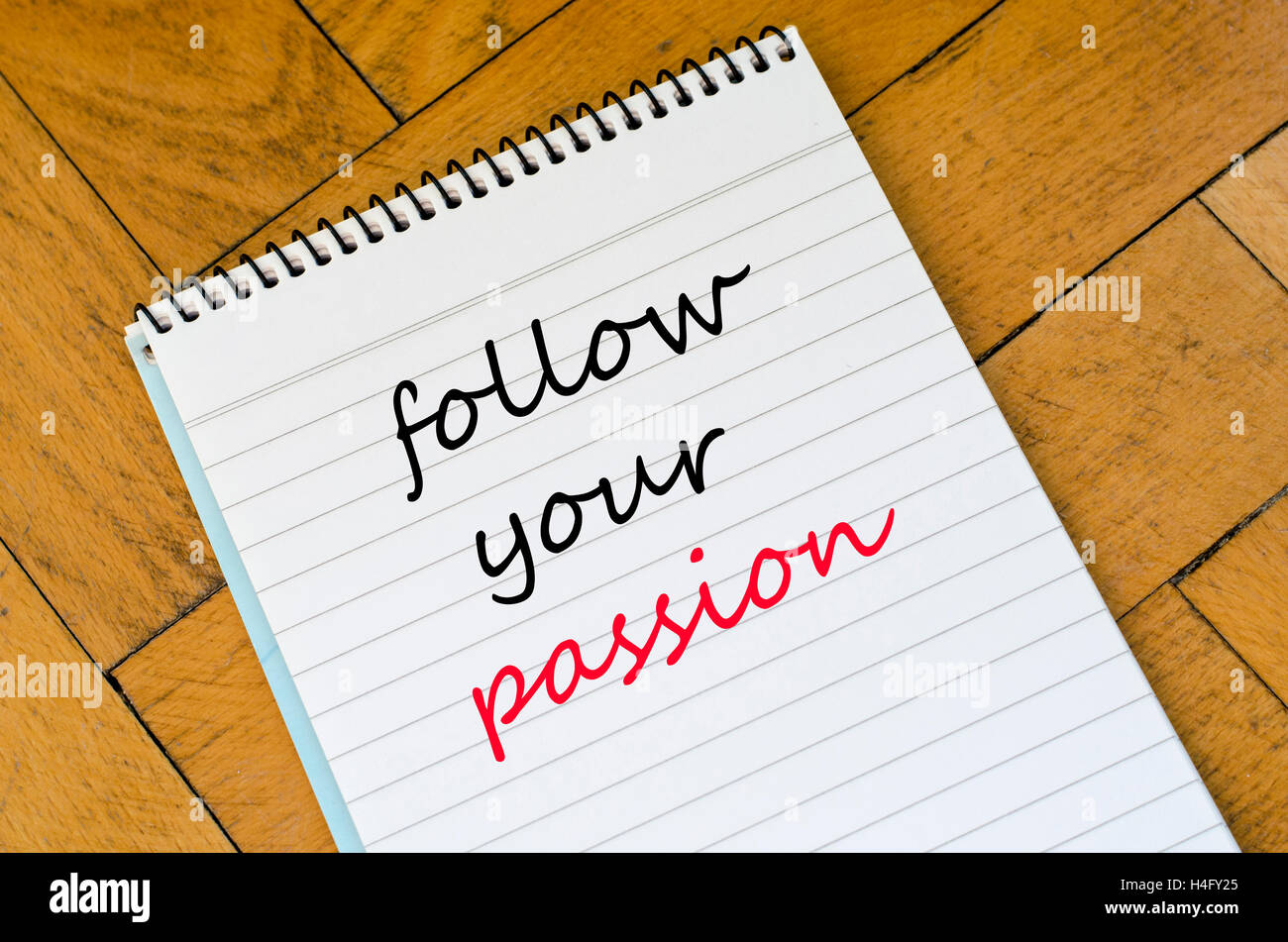 Follow your passion text concept write on notebook Stock Photo - Alamy