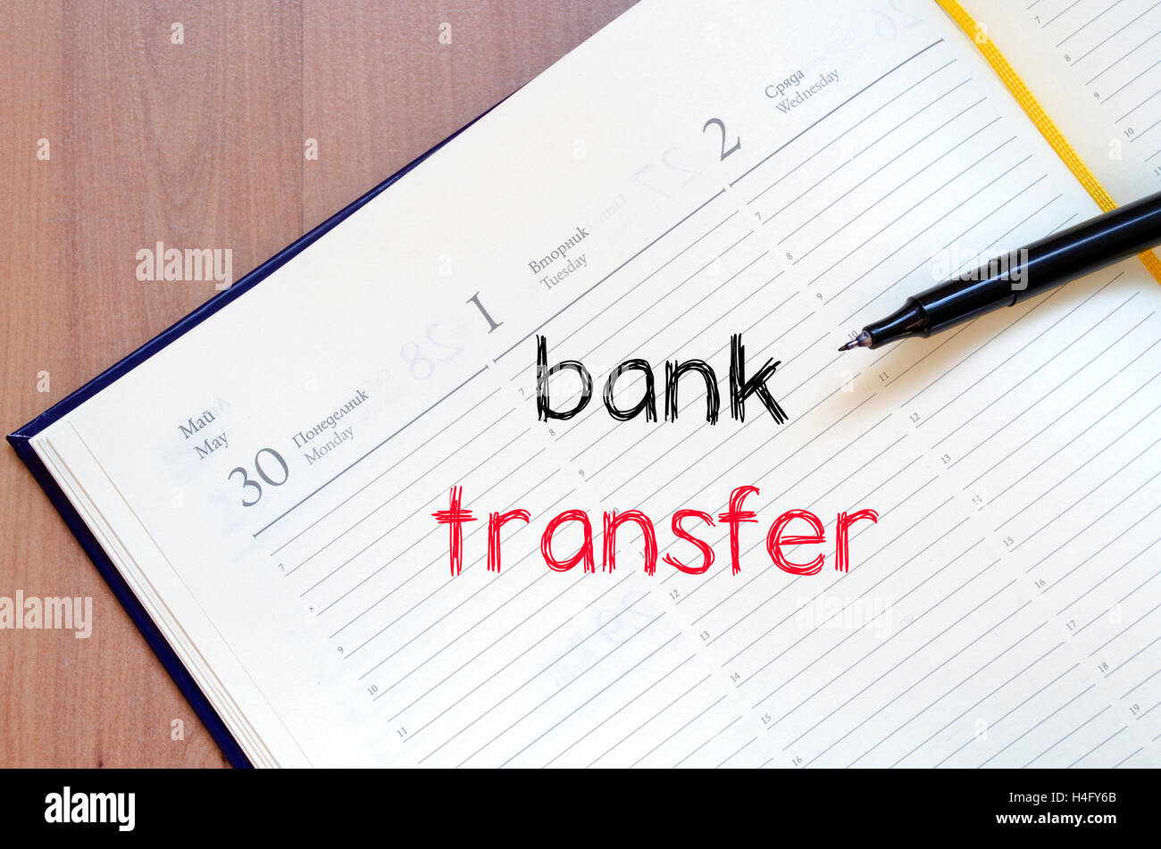 Bank transfer text concept write on notebook Stock Photo - Alamy