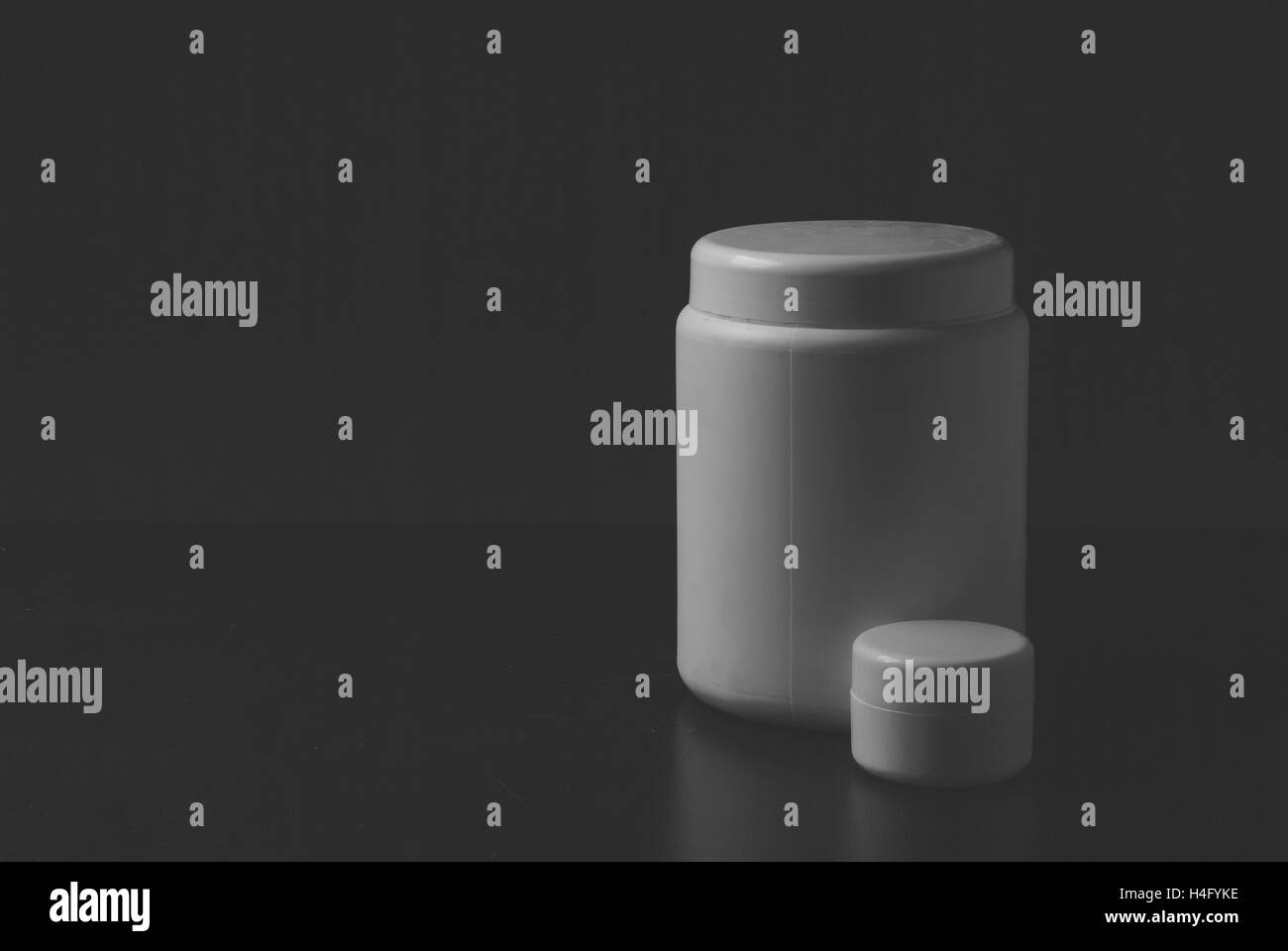 Hair treatment cosmetic products Black and White Stock Photos & Images ...