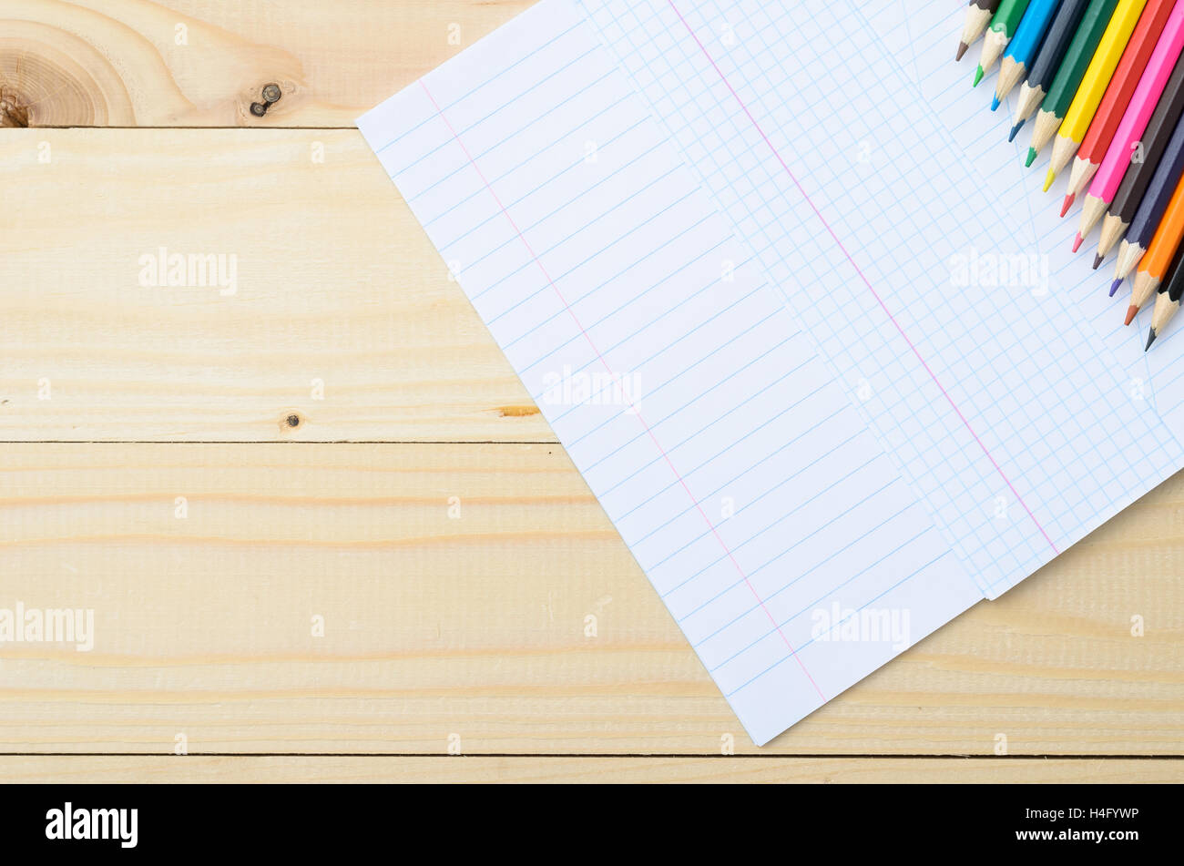 Colored pencils and paper Stock Photo - Alamy