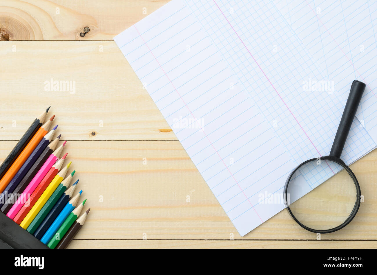 Colored pencils and paper Stock Photo - Alamy