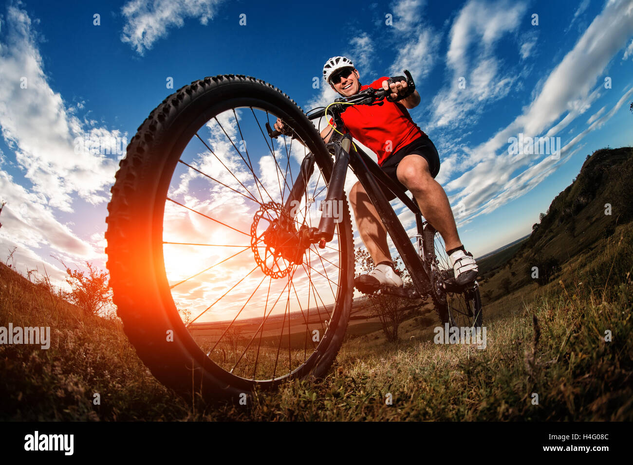 Mountain Bike cyclist riding single track outdoor with blue sky on ...