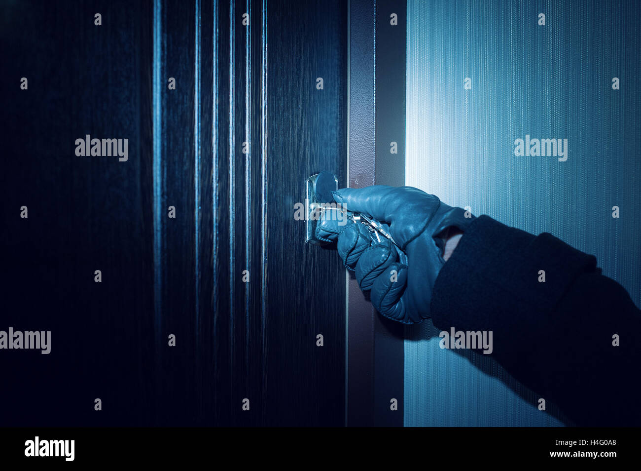 man in gloves opens the door Close up Stock Photo - Alamy