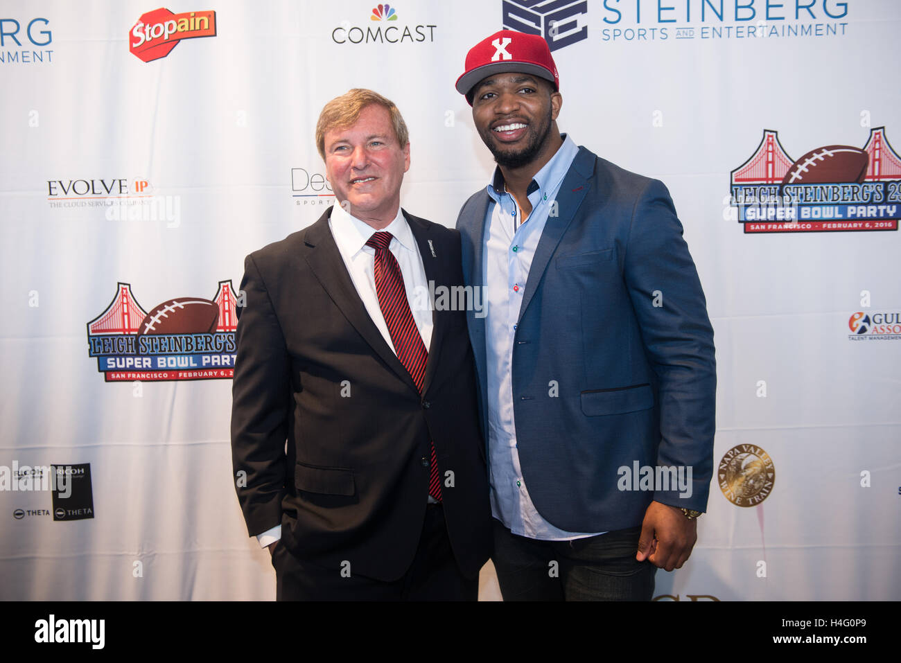 Leigh Steinberg poses with Sam Barrington on the red carpet at the ...
