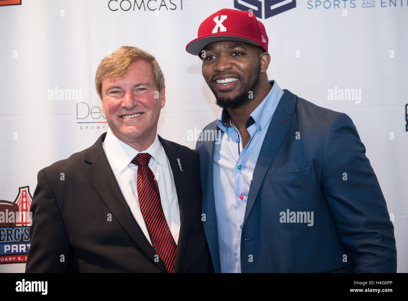 Leigh Steinberg poses with Sam Barrington on the red carpet at the ...