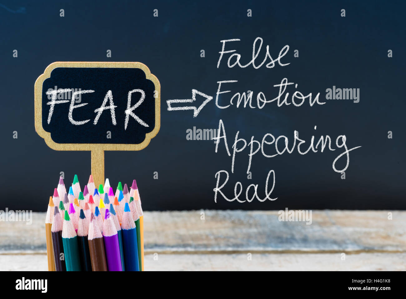 Business Acronym FEAR False Emotion Appearing Real written with chalk ...