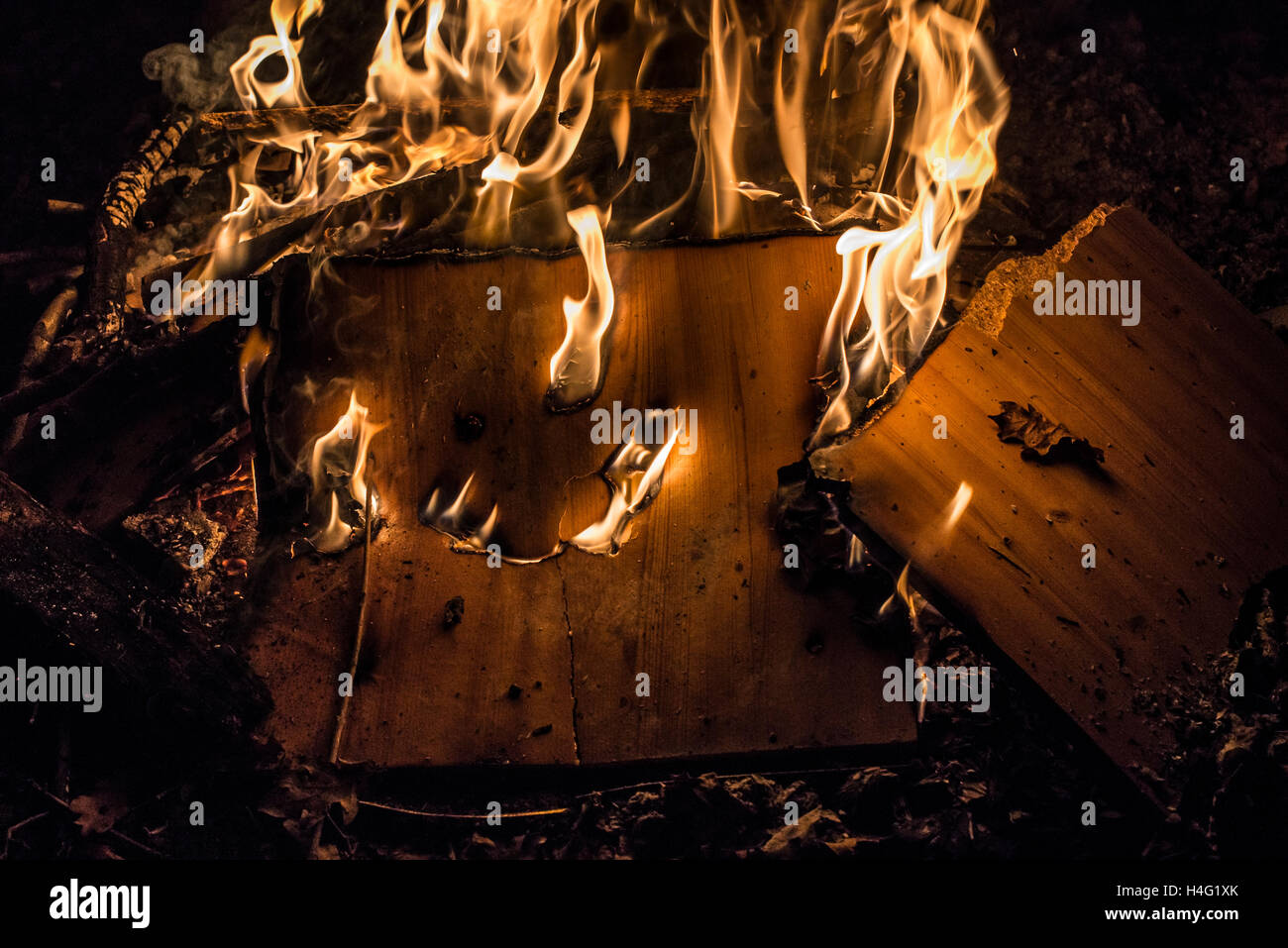 A smiley face on fire Stock Photo - Alamy