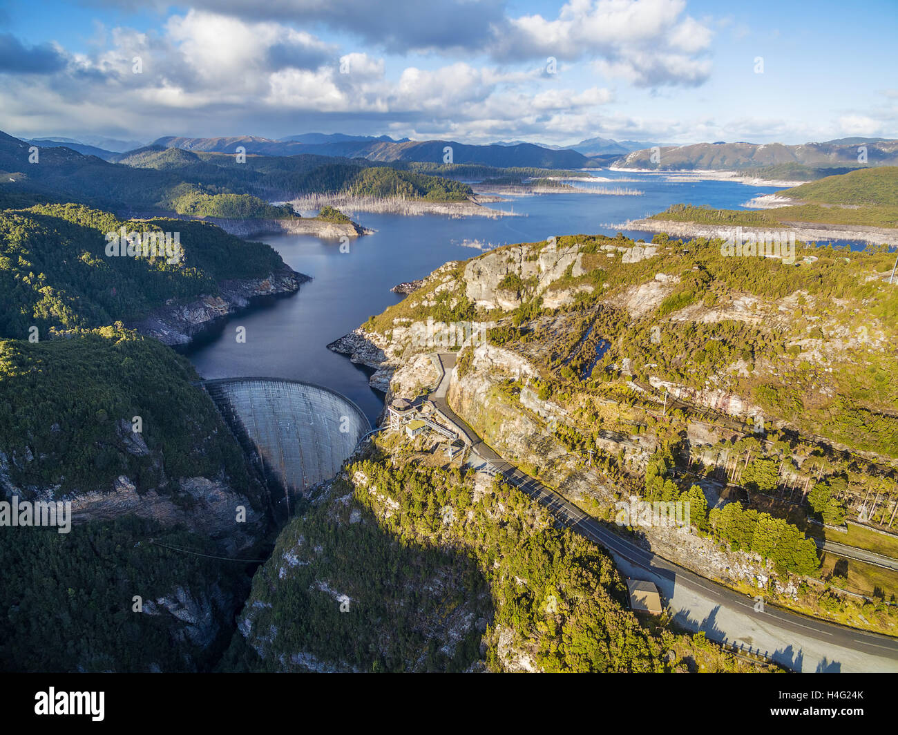 Aerial view of Gordon Dam and lake at sunset. Southwest, Tasmania ...