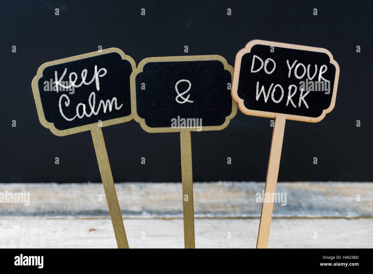 Keep Calm and Do Your Work message written with chalk on mini ...