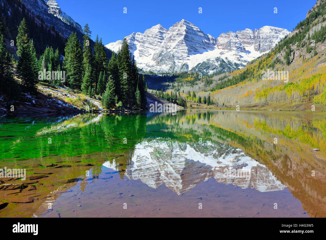 landscape view of the Maroon Bells during foliage season with snow ...