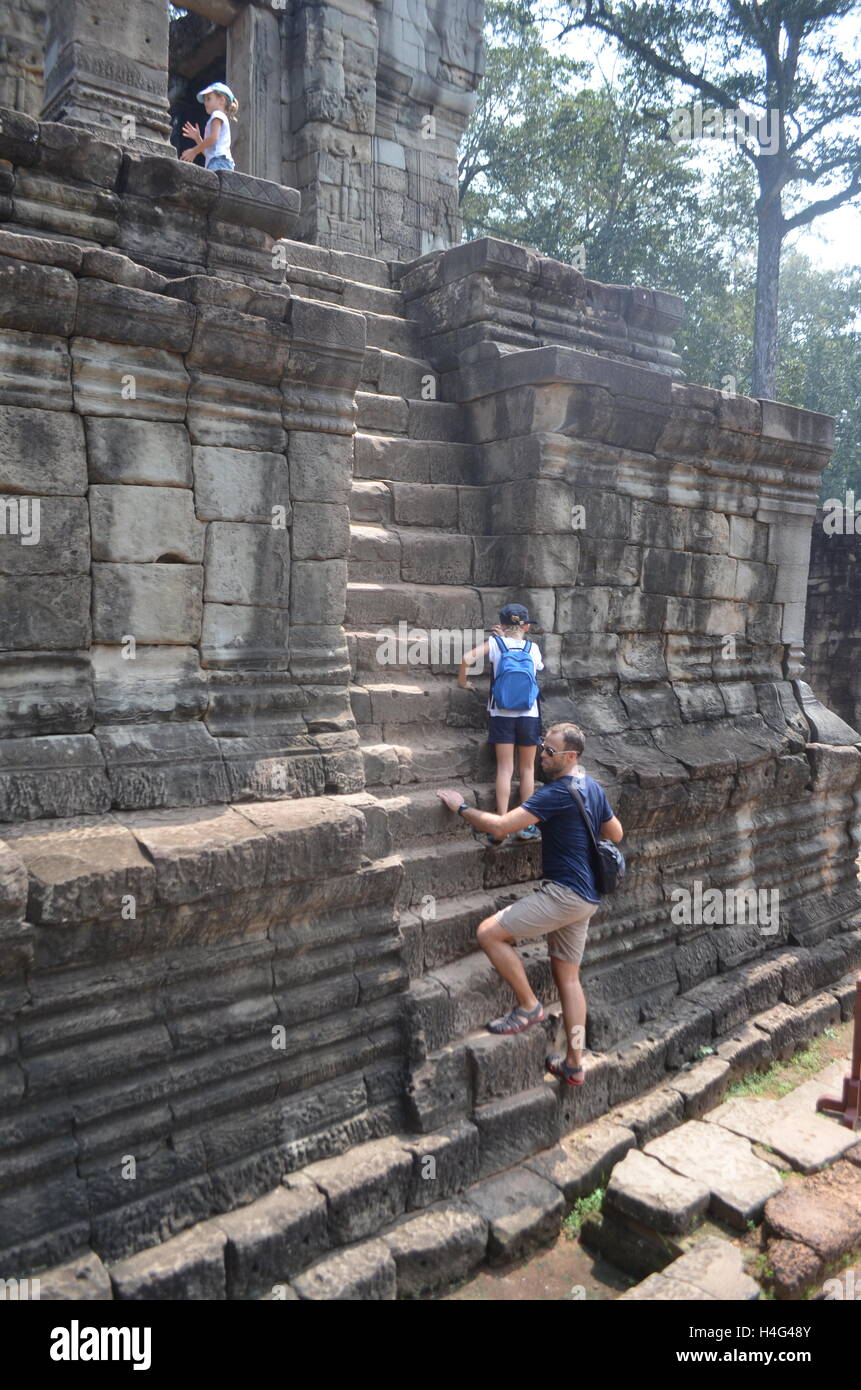 Hiking the ruins of Angkor Wat Stock Photo - Alamy
