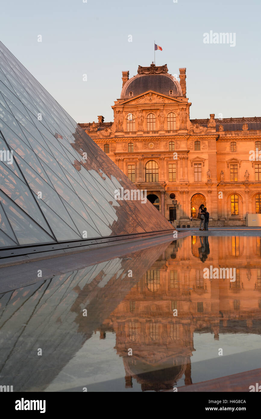 PARIS - AUGUST 15, 2016 Louvre museum at twilight in summer. Louvre ...