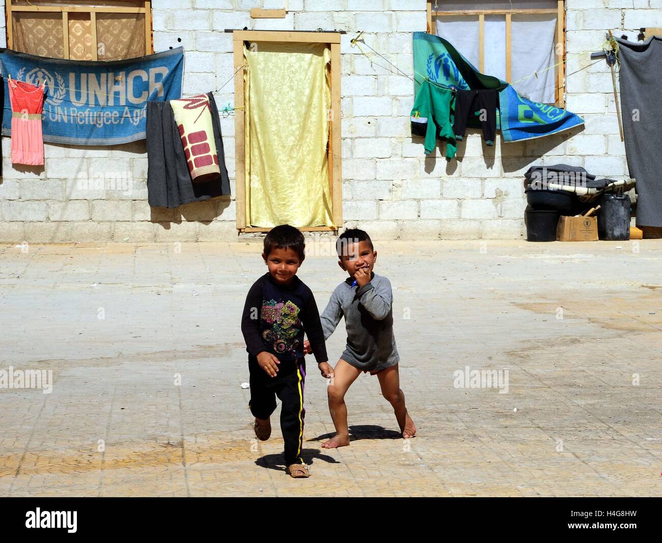 Damascus. 15th Oct, 2016. Syrian kids play at a yard in a displacement ...