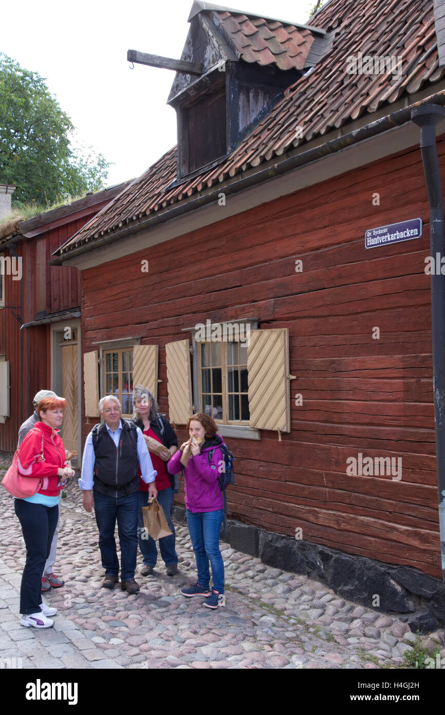 Visitors stroll the grounds of Skansen, the world's first open-air ...