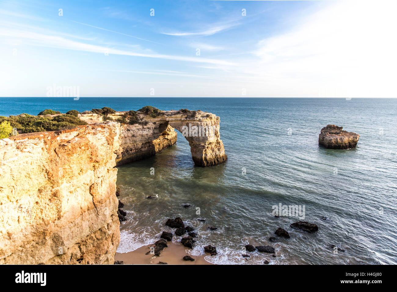Natural arch at the Algarve coast in Portugal Stock Photo - Alamy