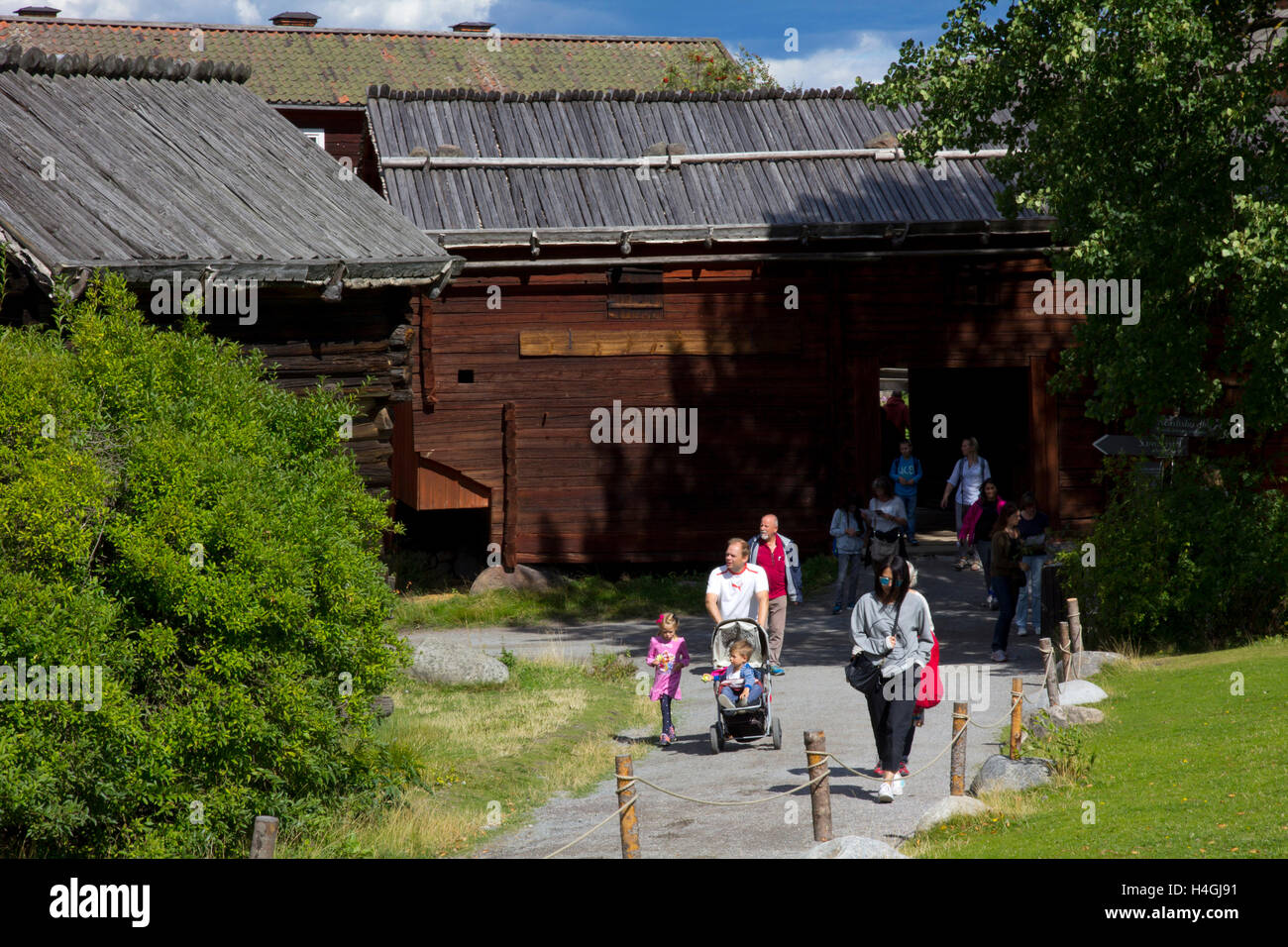 Visitors stroll the grounds of Skansen, the world's first open-air ...