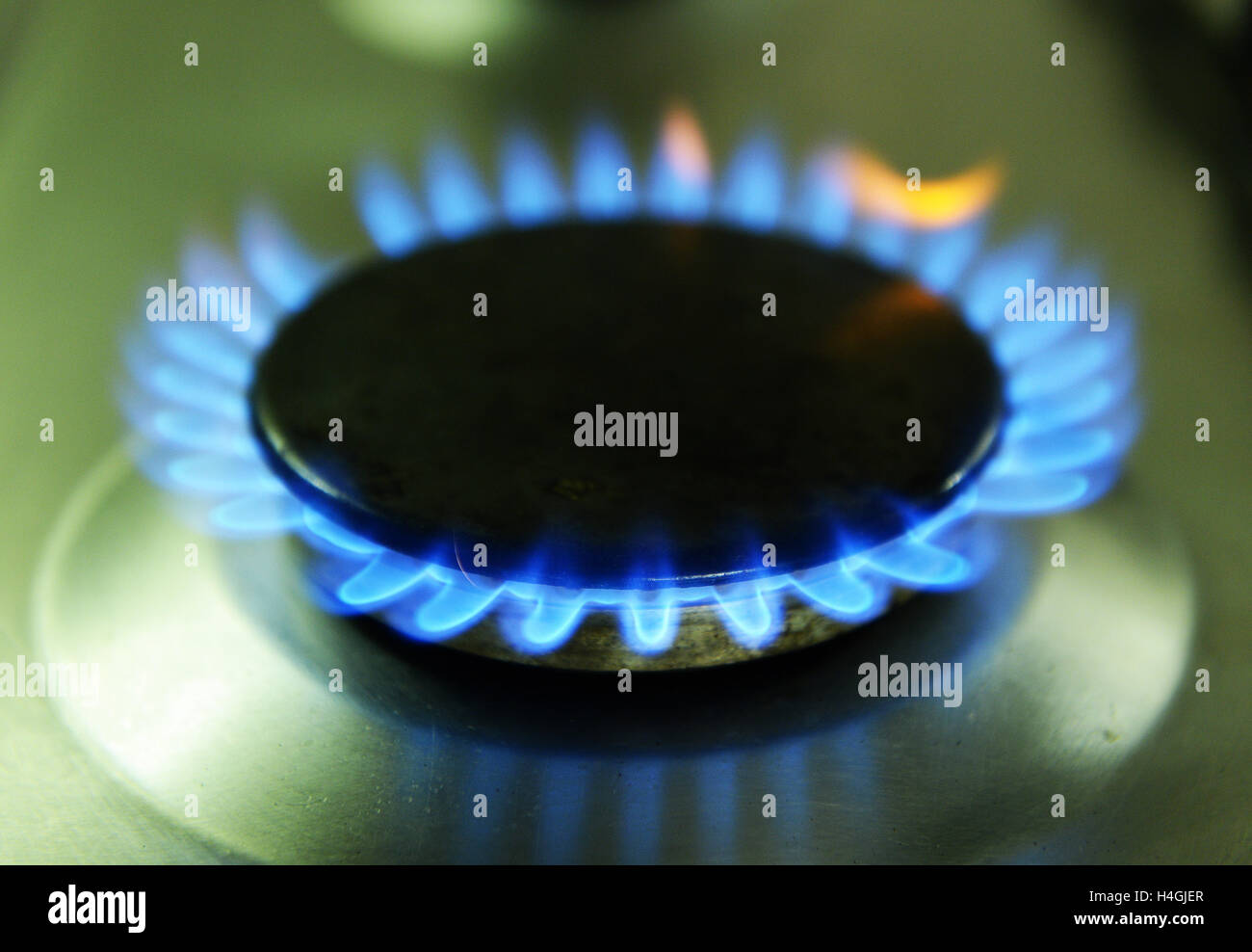A gas burner on a hob cooking appliance Stock Photo - Alamy