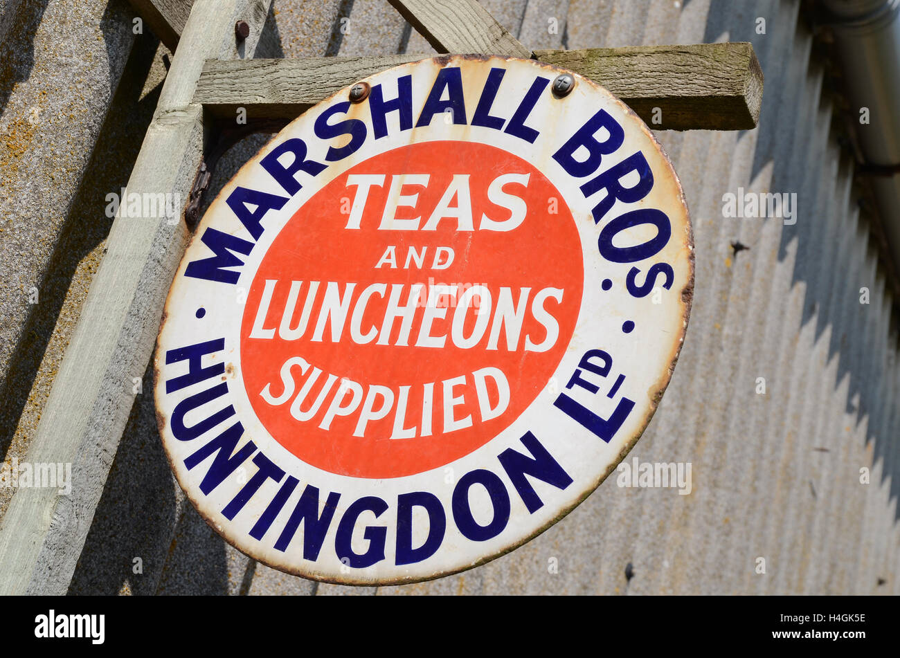 Old metal advertising sign Stock Photo - Alamy