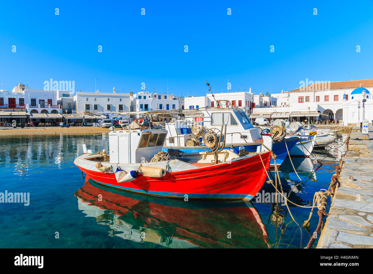 Greek fishing boats mooring in Mykonos port on island of Mykonos ...