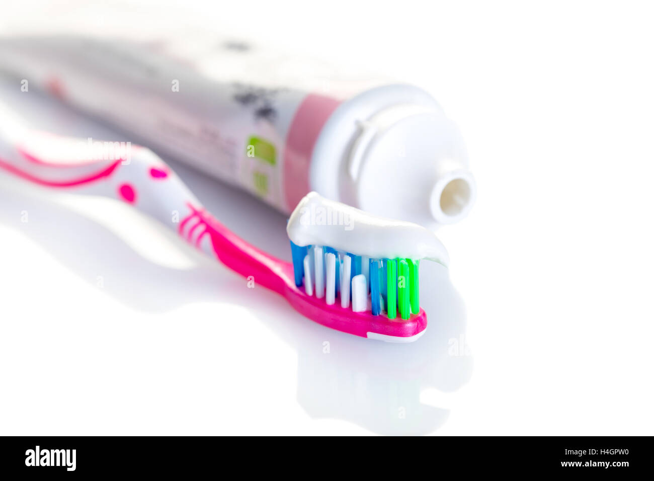 toothbrush with toothpaste close-up on white background Stock Photo - Alamy