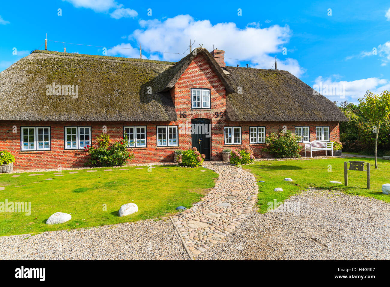 SYLT ISLAND, GERMANY - SEP 11, 2016: traditional house with straw roof ...