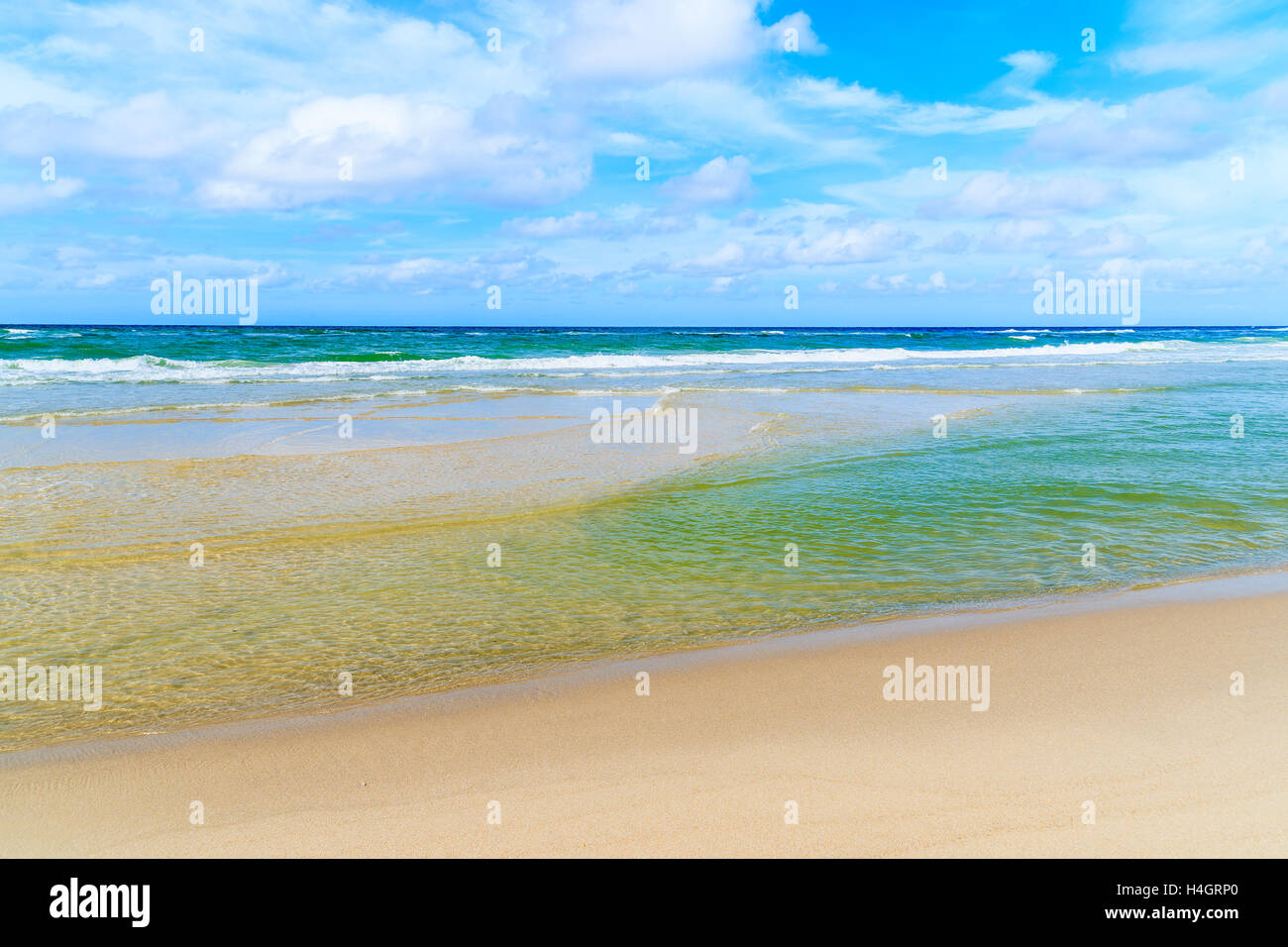 Shallow sea water on beautiful sandy beach at low tide, Sylt island ...