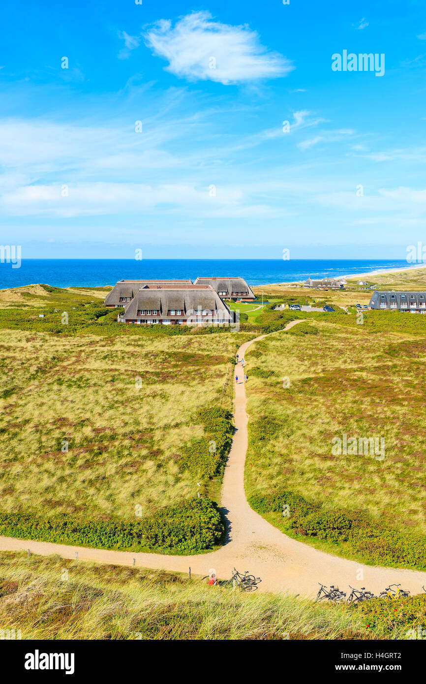 People walking on countryside path in Kampen village on western coast ...
