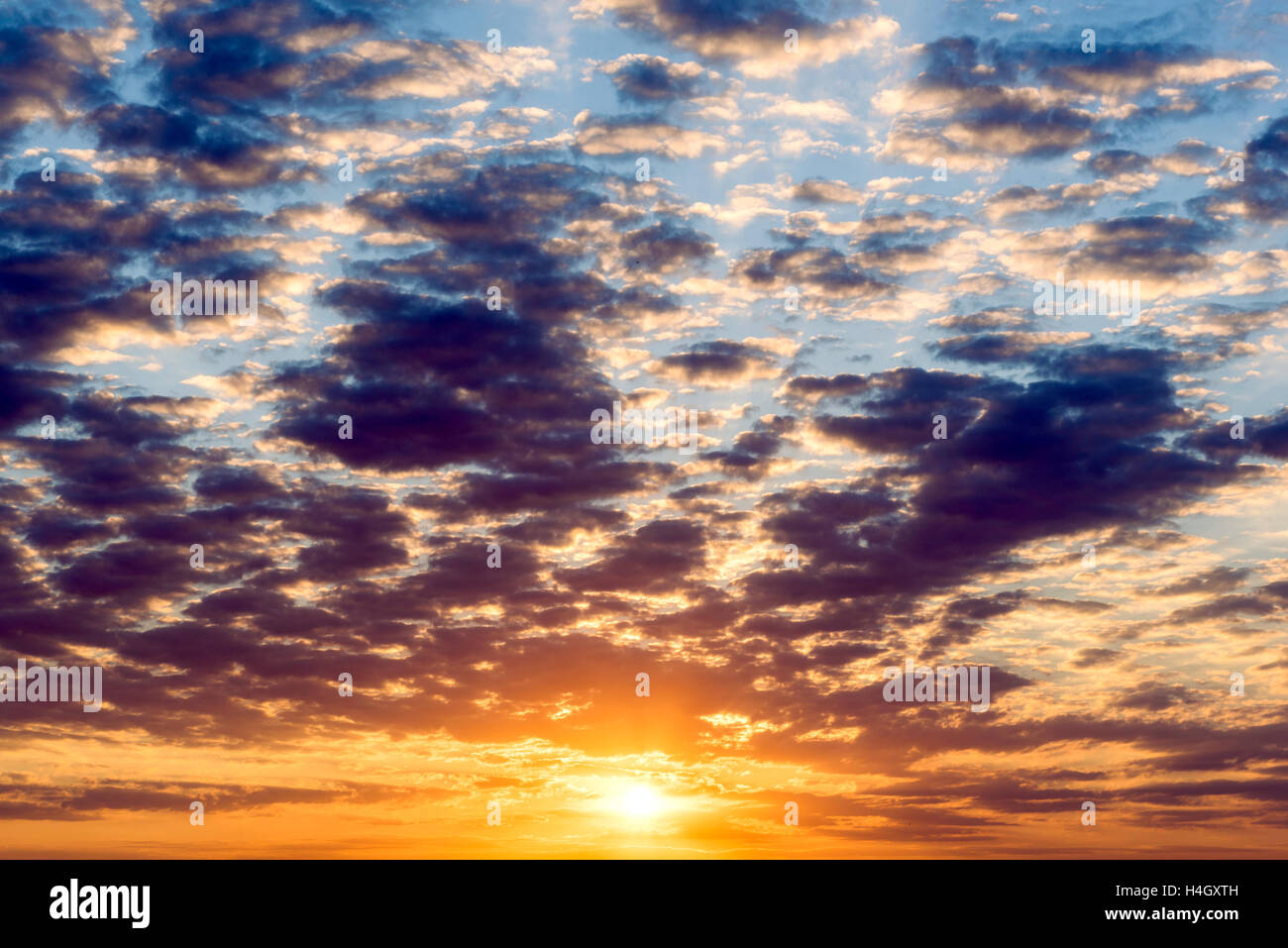 Beautiful sunrise and dramatic clouds Stock Photo - Alamy