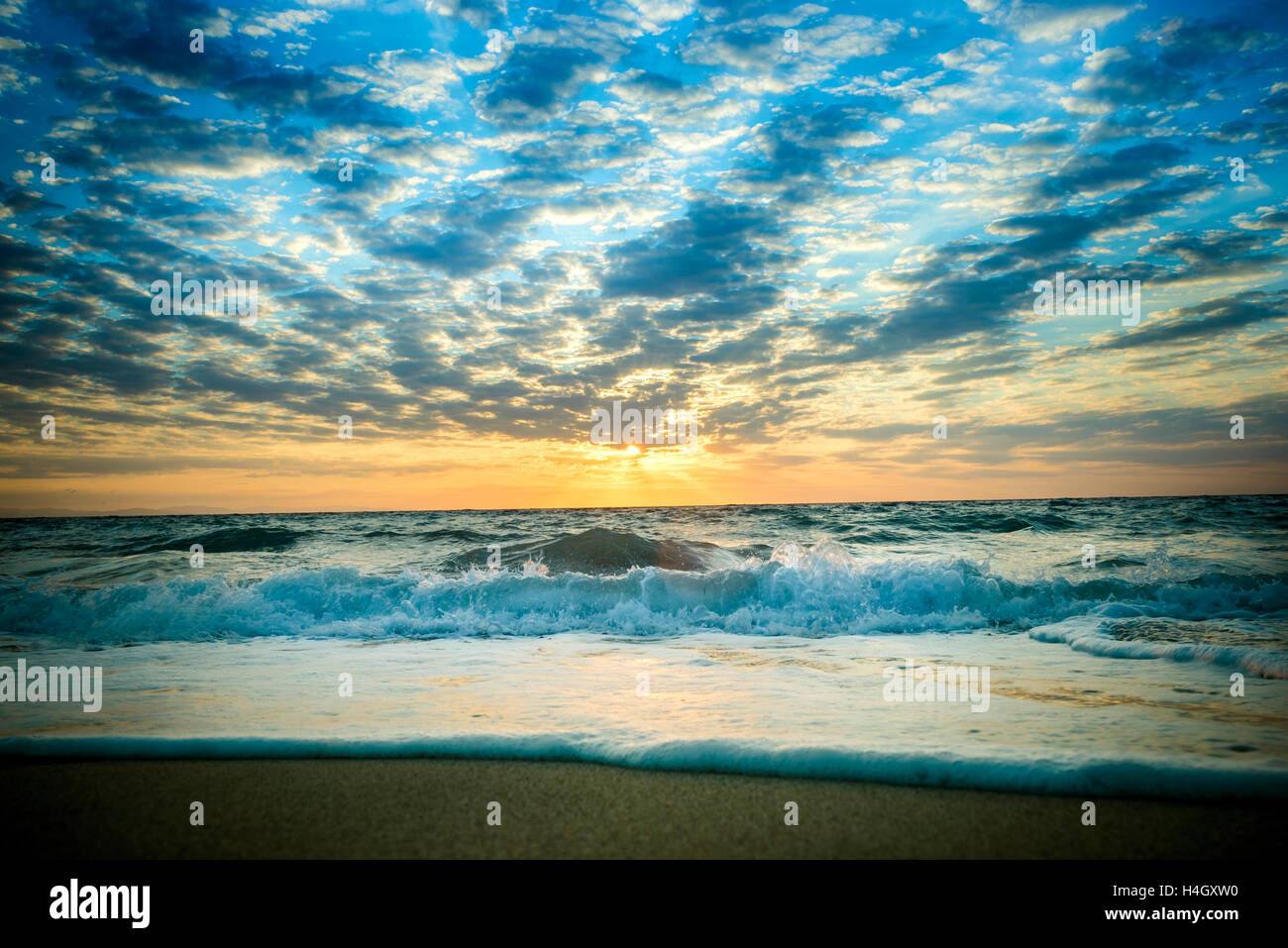 Beautiful dramatic sky over the beach as background Stock Photo - Alamy