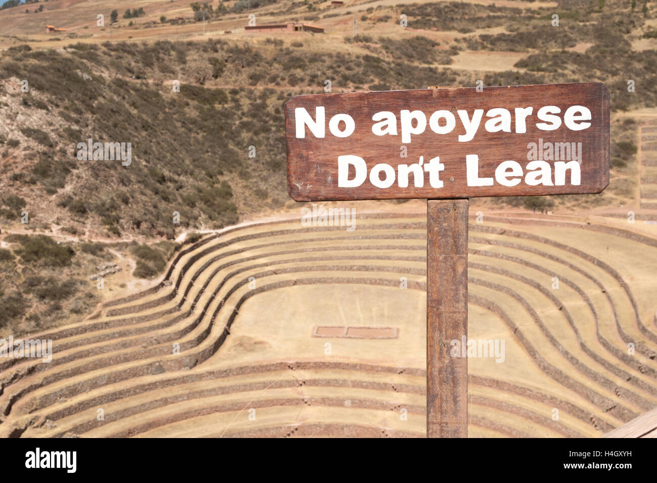 Sign reading "No apoyarse Don't Lean" with stone farming terraces at ...