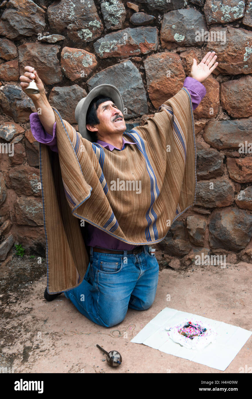 Peruvian Shaman doing coca leaf blessing for Pachamama in mountaintop ...