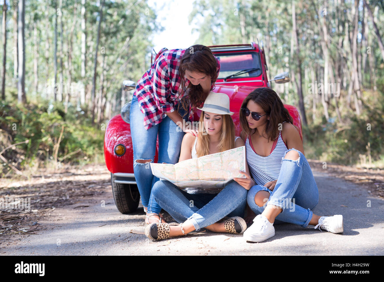 Group of friends on a roadtrip through countryside Stock Photo - Alamy