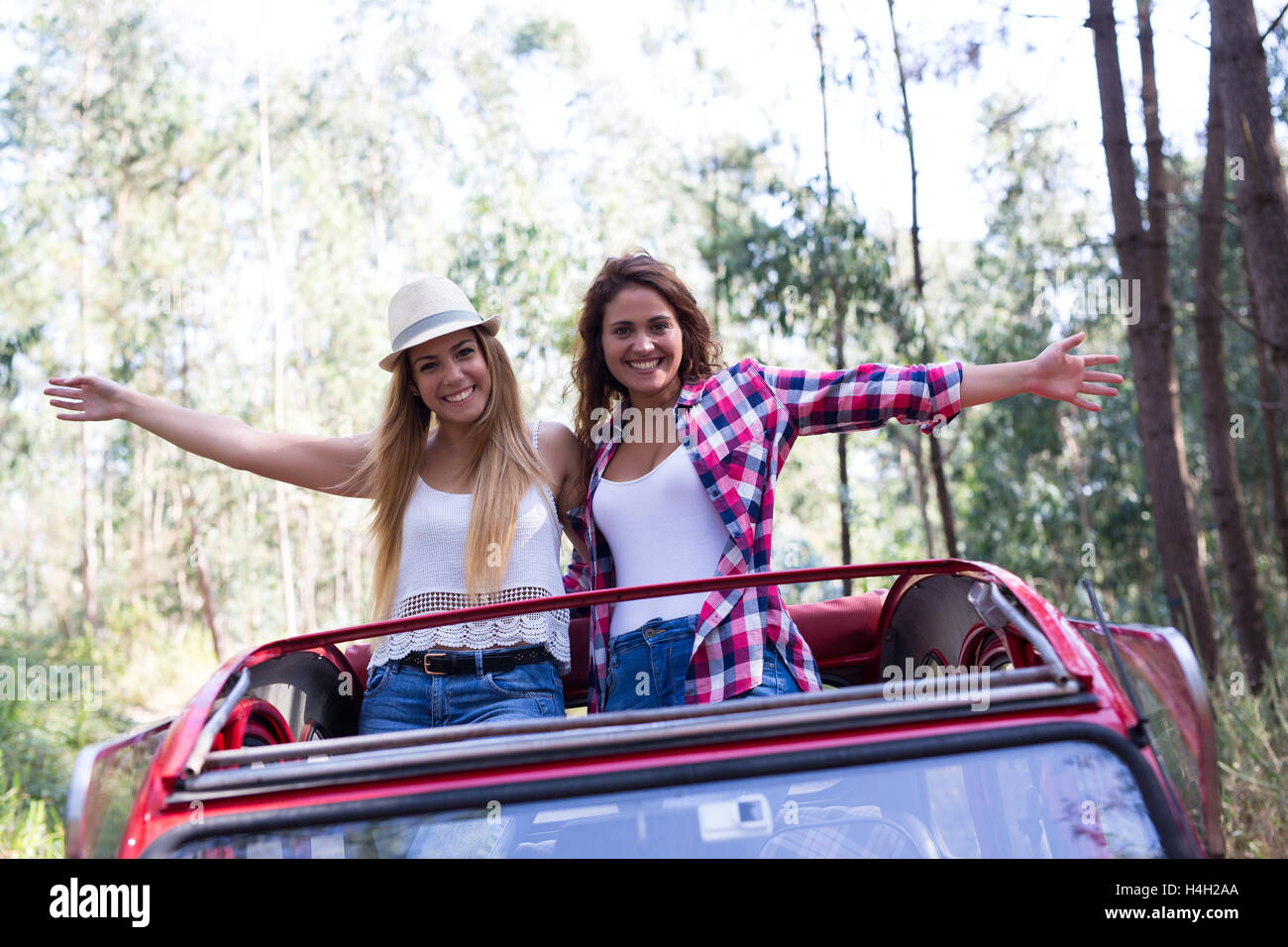 Group of friends on a roadtrip through countryside Stock Photo - Alamy