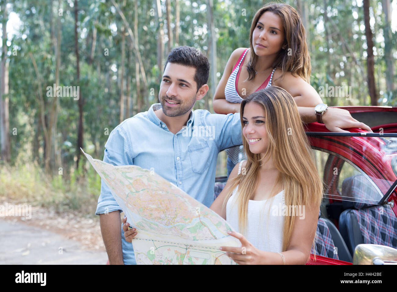 Group of friends on a roadtrip through countryside Stock Photo - Alamy