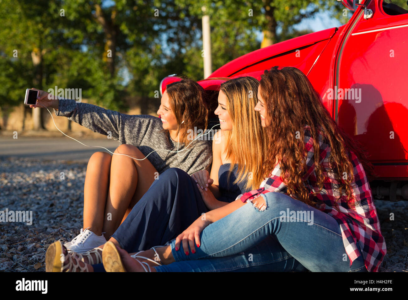 Group of friends on a roadtrip through countryside Stock Photo - Alamy