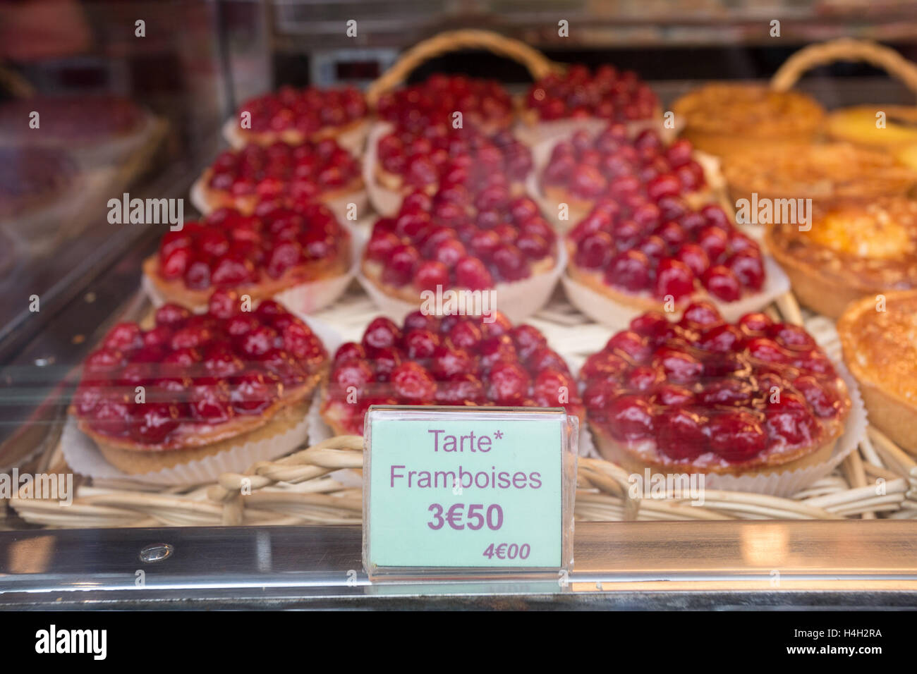 Local patiserie in Paris showing the typical french pastries: raspberry ...