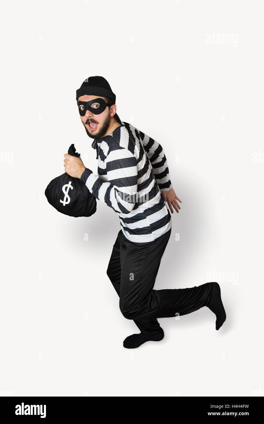 Burglar got caught whlie he is running Stock Photo - Alamy
