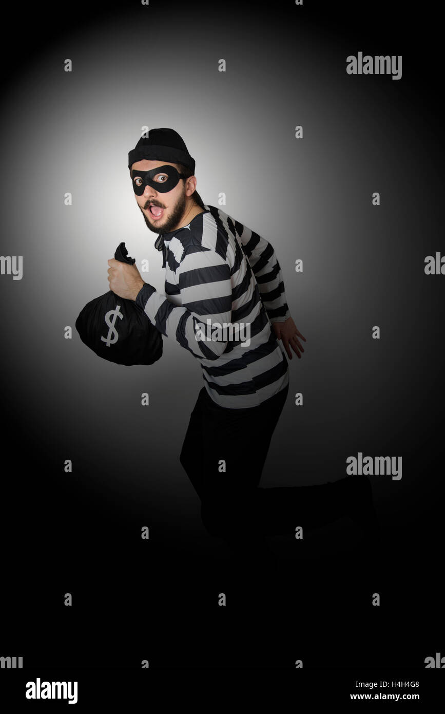 Burglar got caught whlie he is running Stock Photo - Alamy