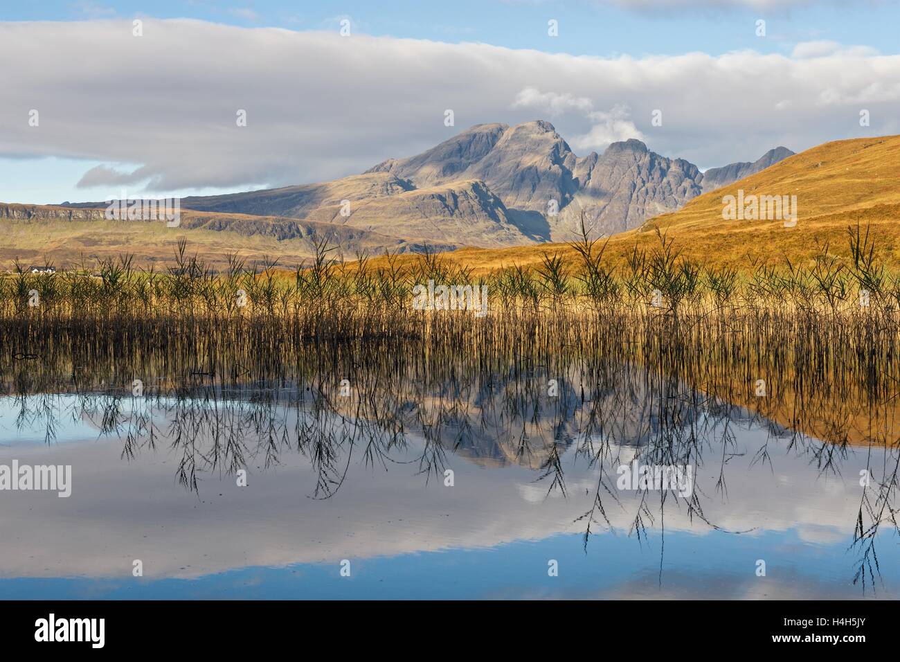 A colour image of the peak of Blaven being reflected into the still ...