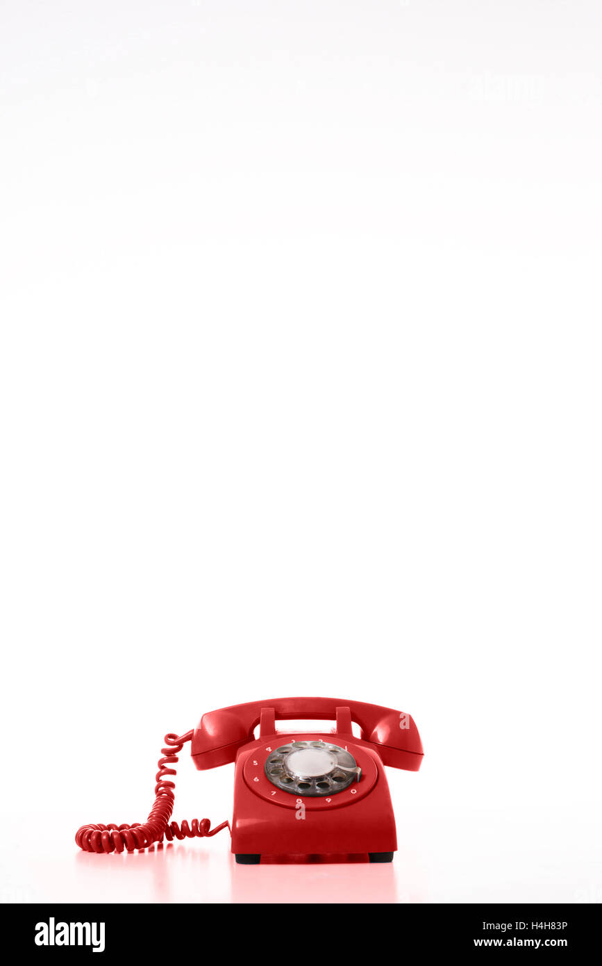 Red old dial-uptelephone is on white background Stock Photo - Alamy