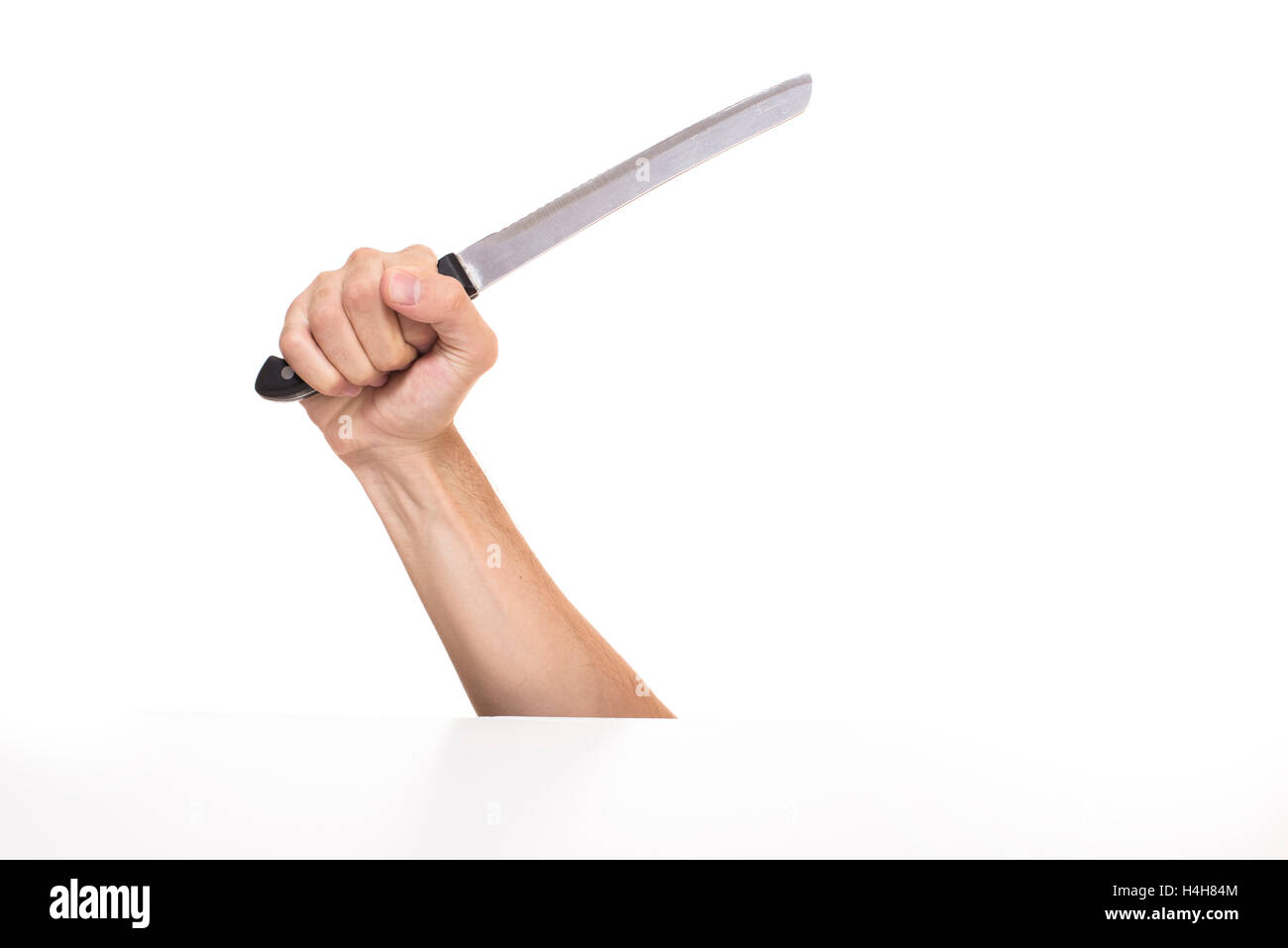 The hand is holding the knife. Isolated on a white background Stock ...