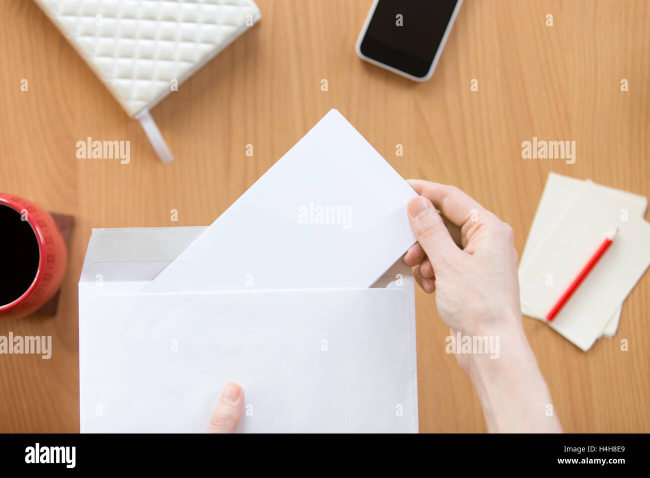 Holding an envelope hi-res stock photography and images - Alamy