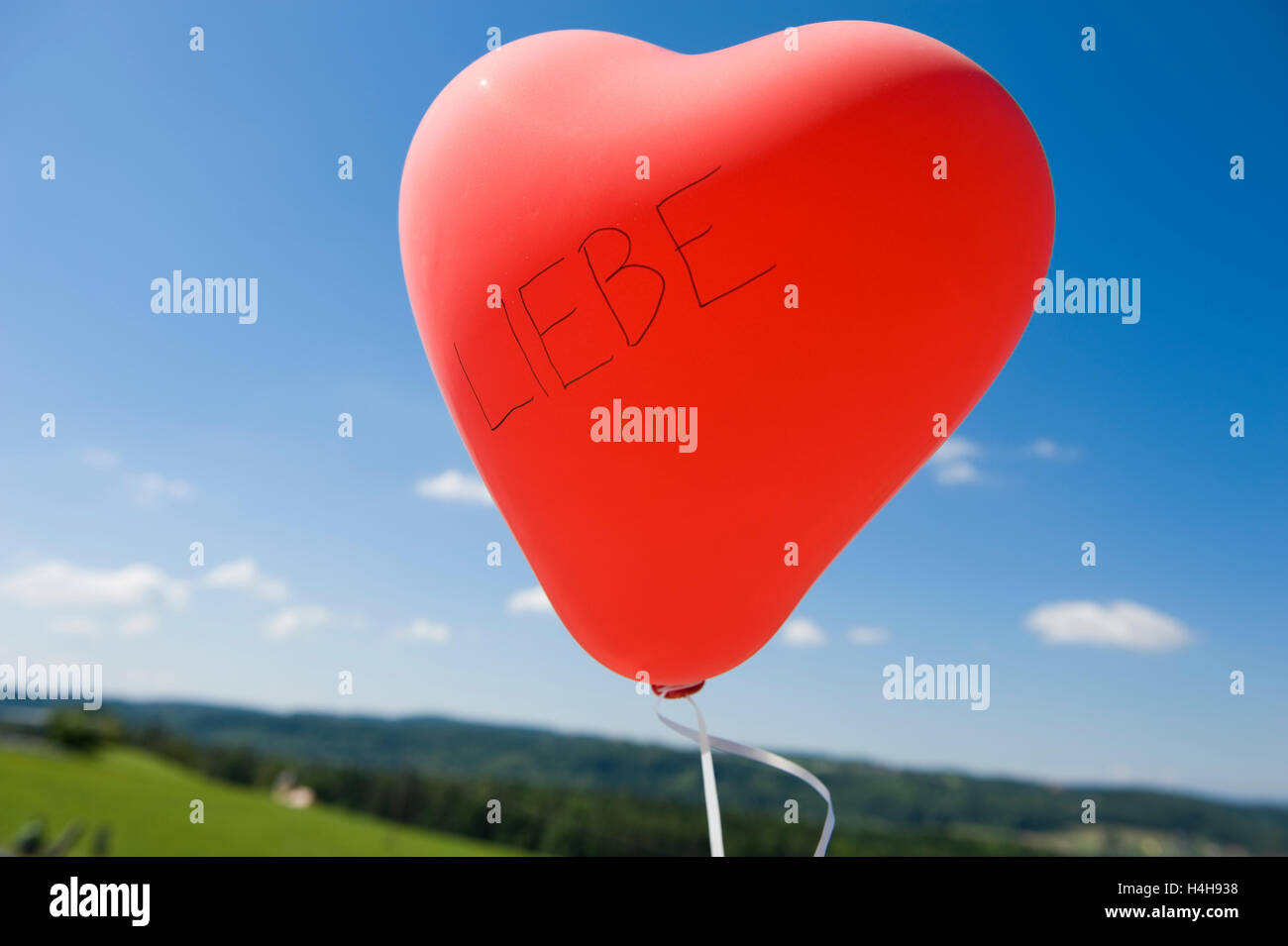 Red balloon message in sky hi-res stock photography and images - Alamy
