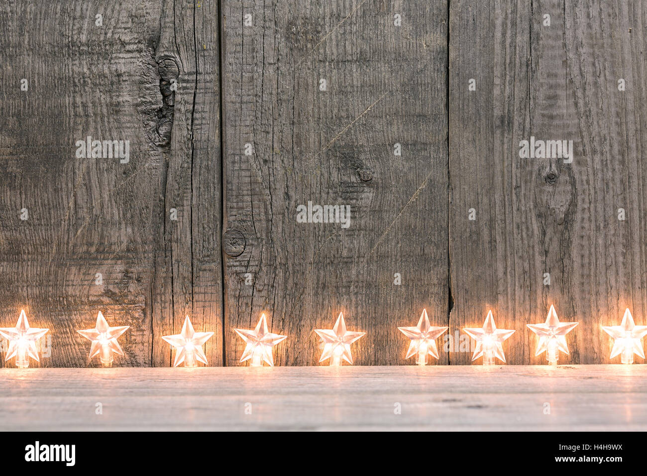 Christmas lights on a rustic wooden plank background Stock Photo - Alamy