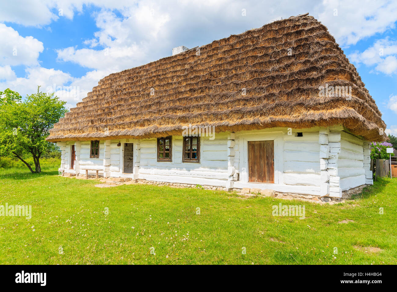 TOKARNIA VILLAGE, POLAND - MAY 12, 2016: An old rustic cottage house on ...