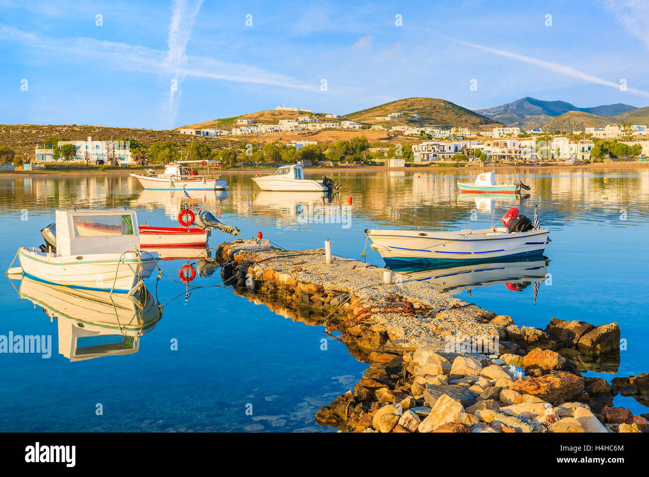 Fishing boats mooring in Naoussa port at sunrise time, Paros island ...