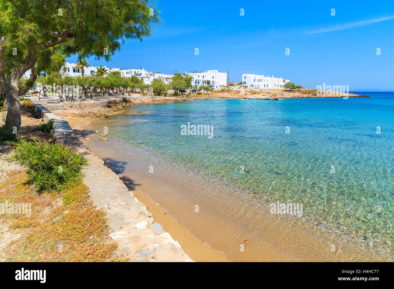 Crystal clear turquoise sea water of a beach in Naoussa village, Paros ...